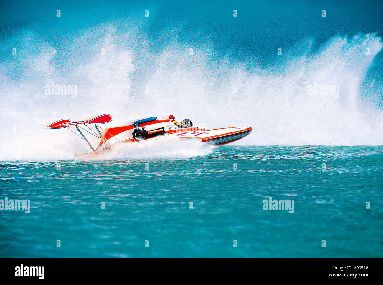 A racing boat speeding across the water Stock Photo - Alamy