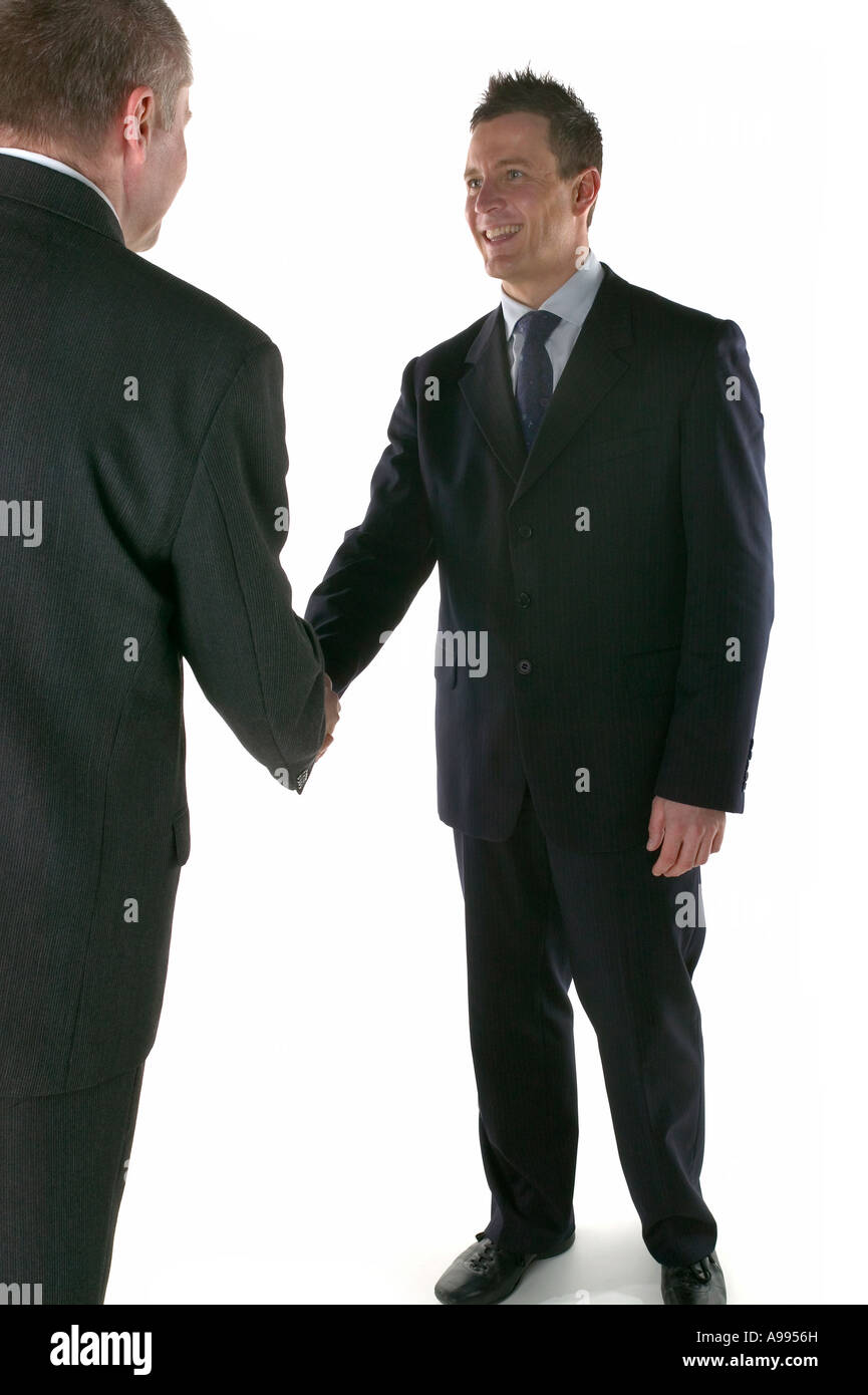 Two businessmen meeting and shaking hands Stock Photo - Alamy