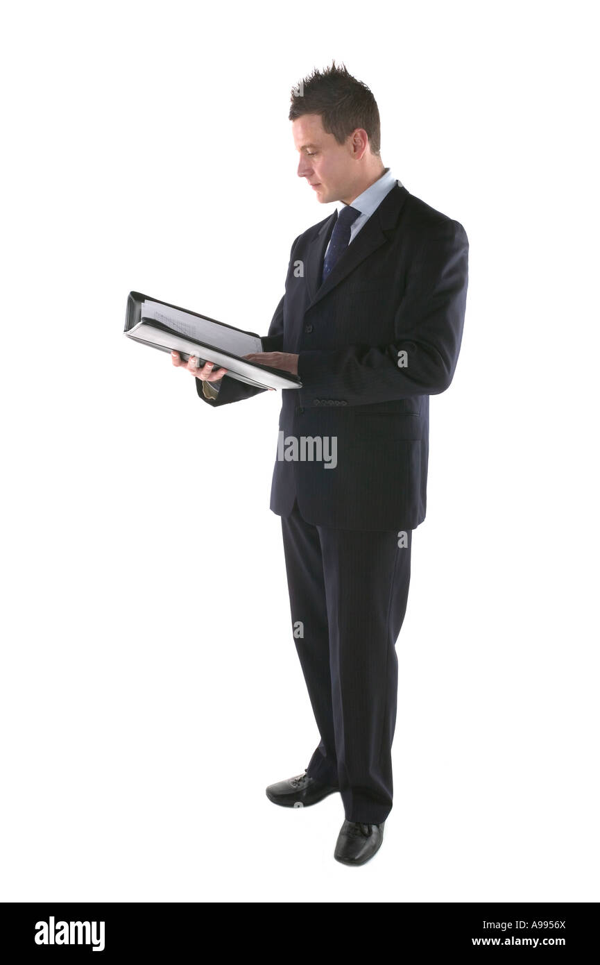 Businessman studying some paperwork isolated on white Stock Photo - Alamy