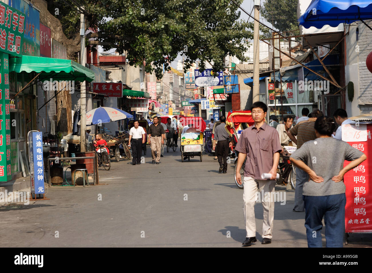 Hutong Lane lined with shops Hutongs are traditonal courtyard homes ...