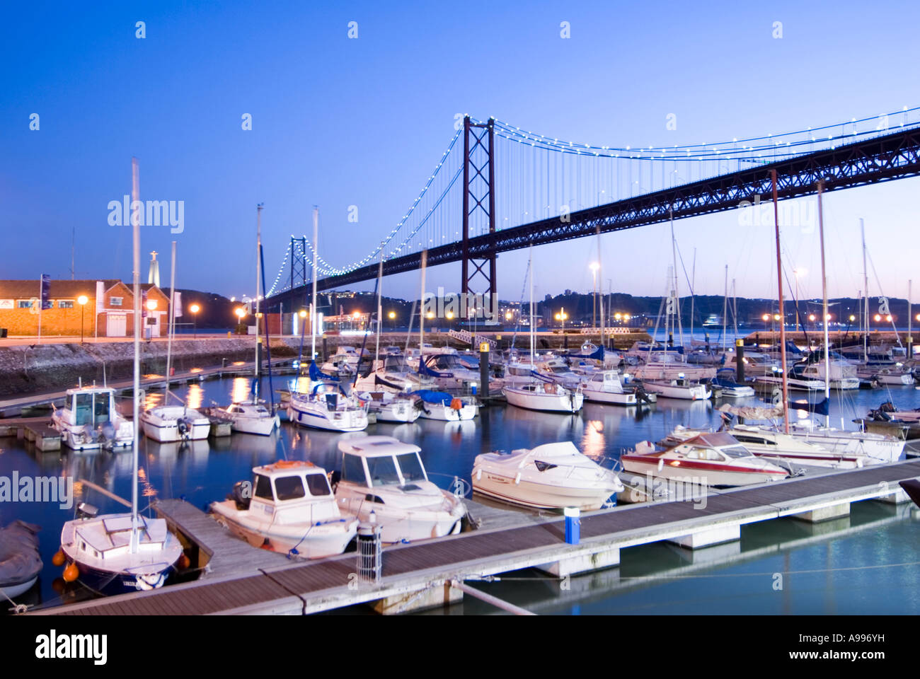 Suspension bridge of Ponte 25 de Abril spanning the docks of Doca de ...