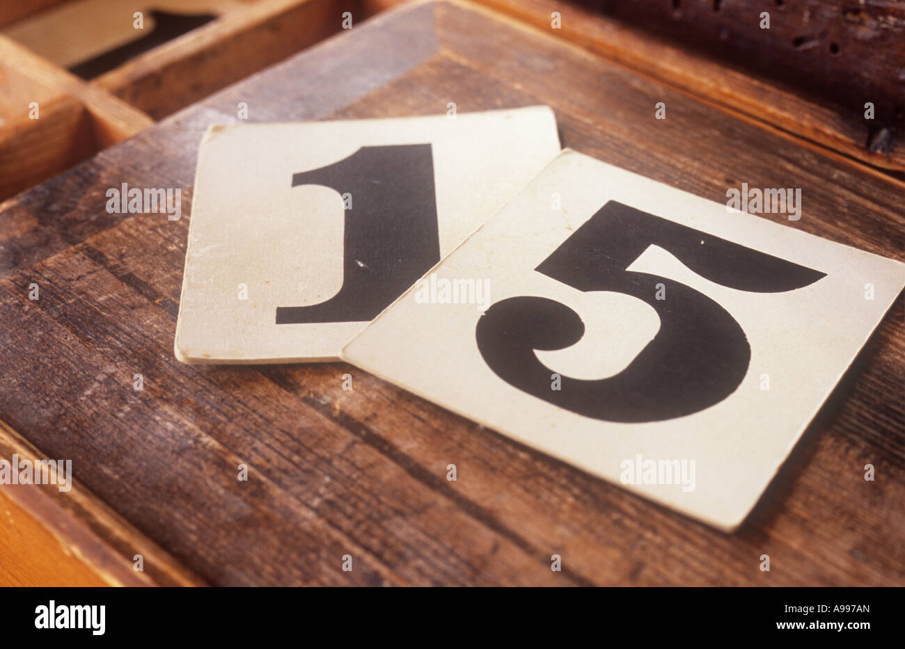 Old-fashioned numerals 1 and 5 printed in black on individual square ...