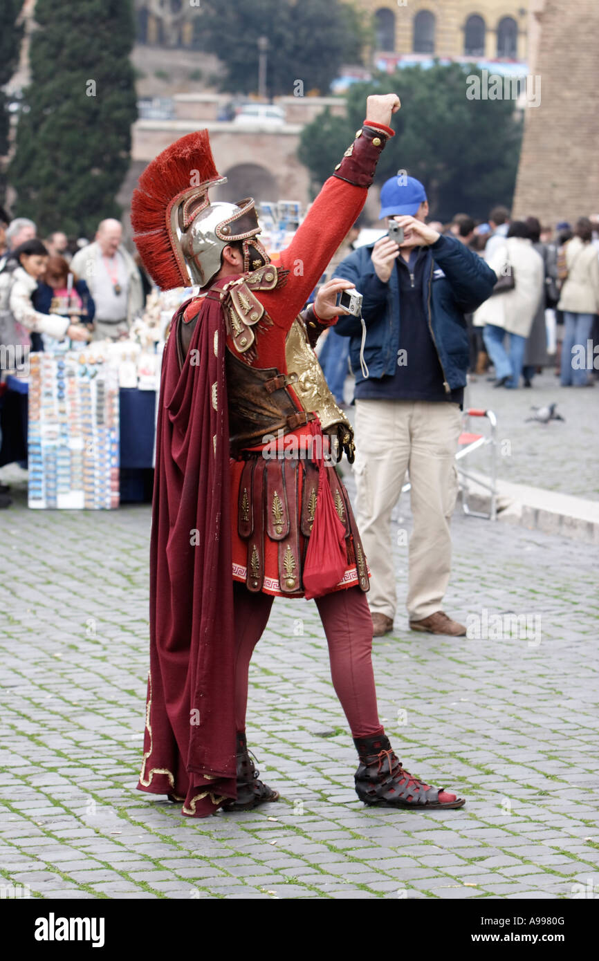 Roman legionnaire poses for a picture near Colosseum in Rome, Italy ...