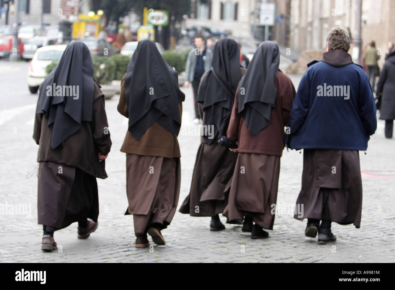 Nuns walk in Rome, Italy Stock Photo - Alamy