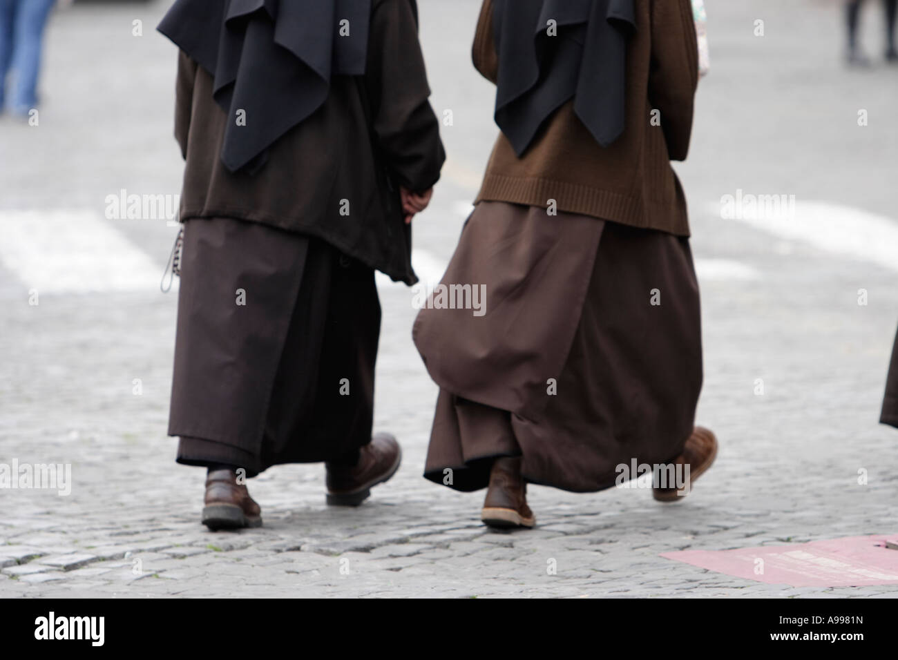 Nuns walk in Rome, Italy Stock Photo - Alamy