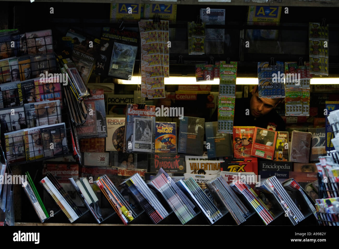 A man sells magazines at a newsstand in downtown Rome, Italy Stock ...