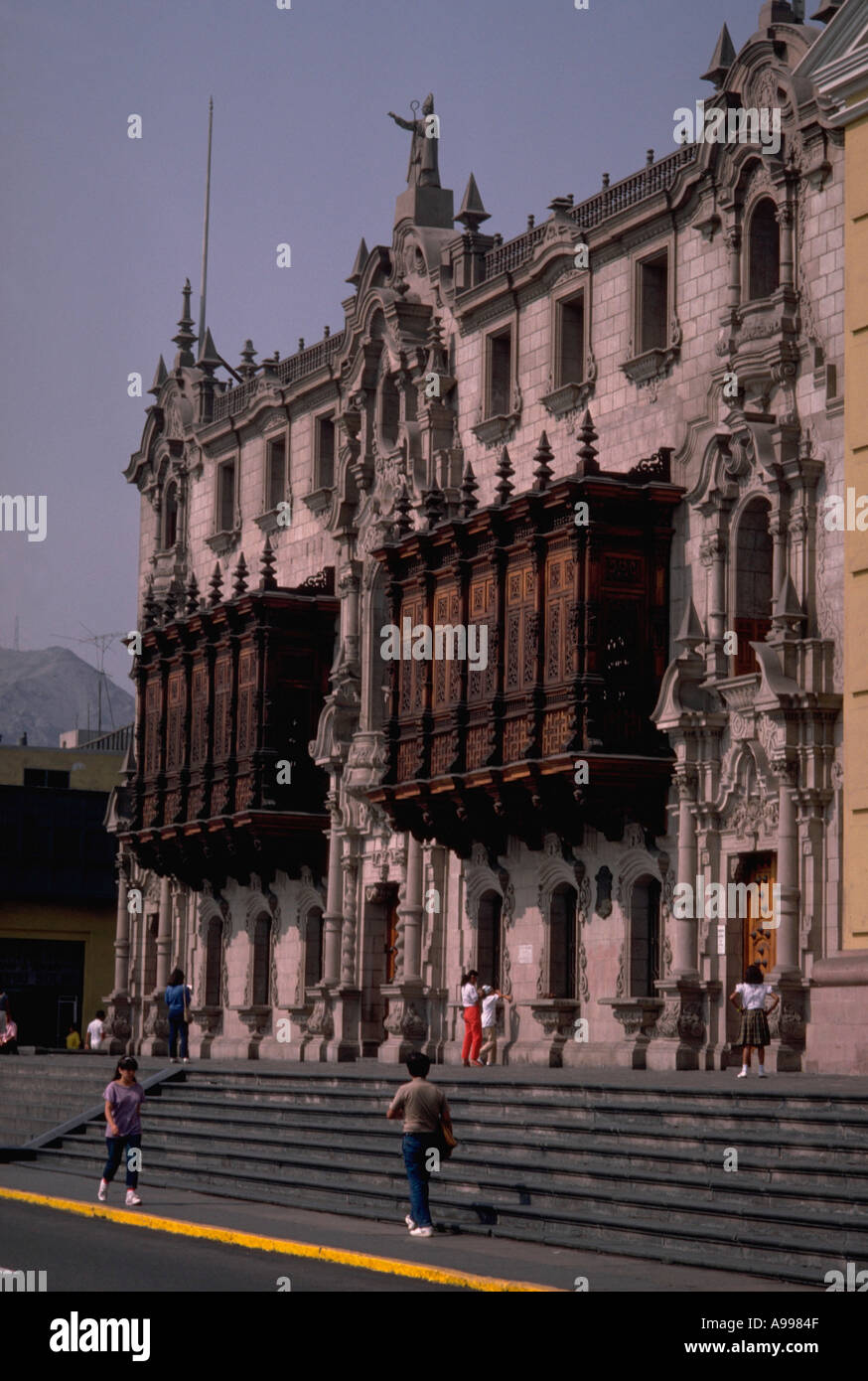 Colonial wooden balconies are attached to the front of the Archbishop ...