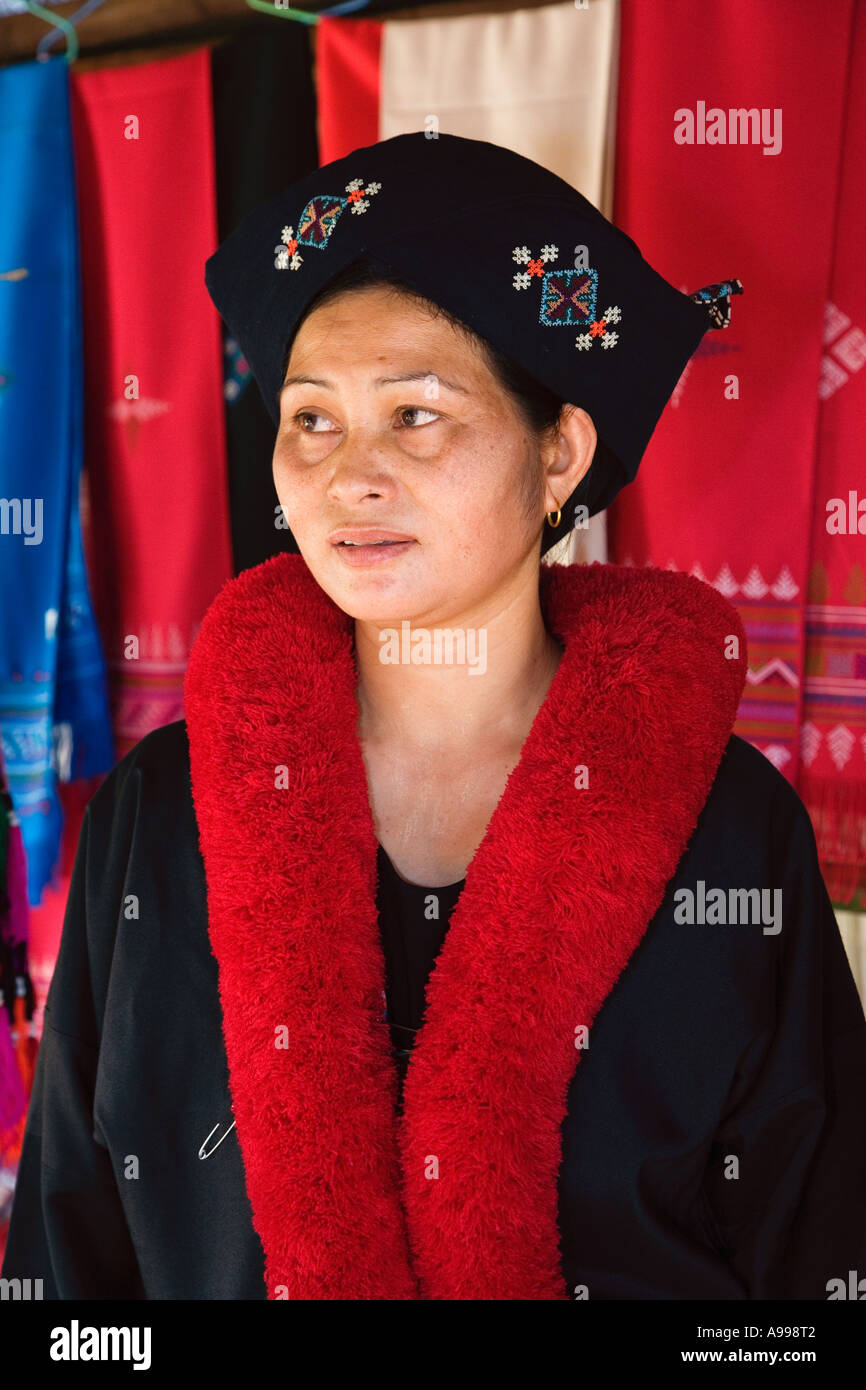 A young Lu Mien woman also called Yao woman with colorful red pom pom ...