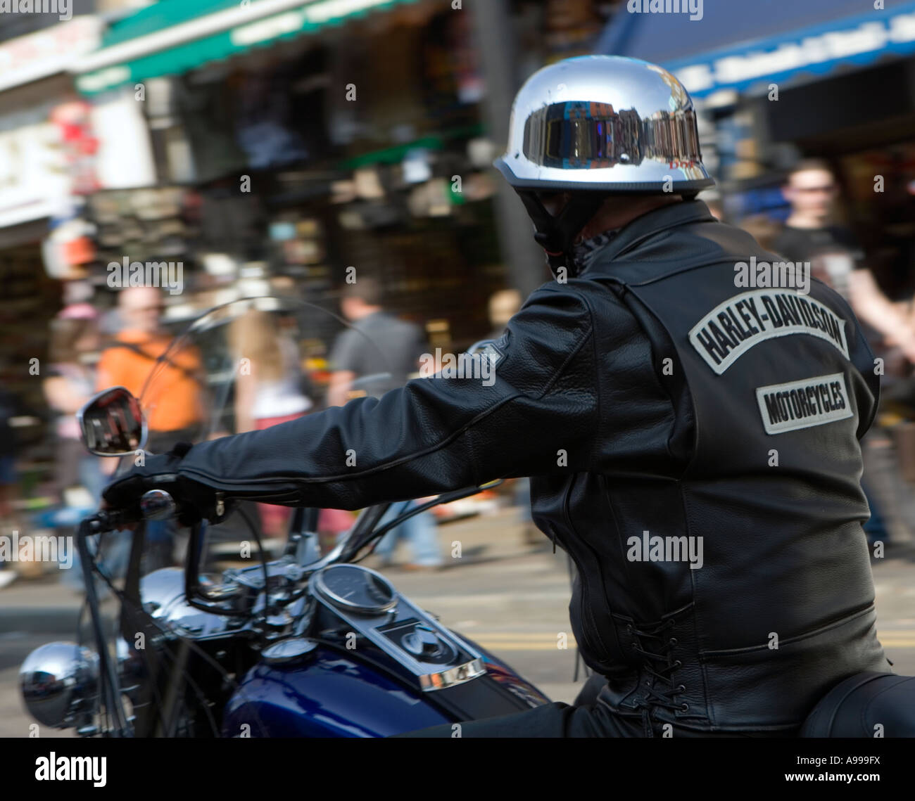 [^Harley ^motorcyclist] with shiny helmet in "Camden High Street ...