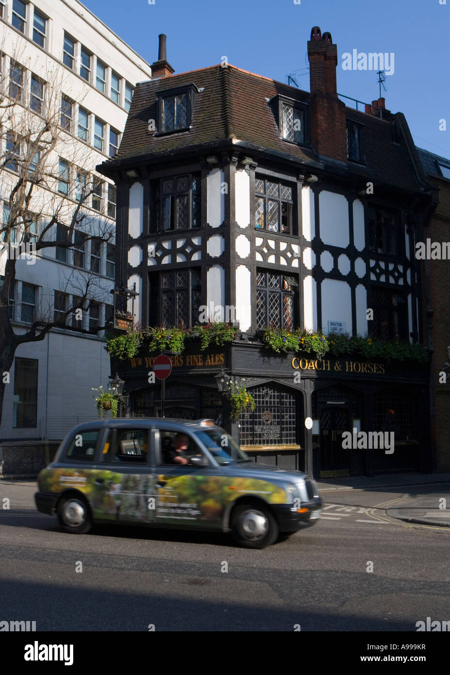 Taxi passes The "Coach and Horses" "Olde worlde" ^pub in "Mayfair ...