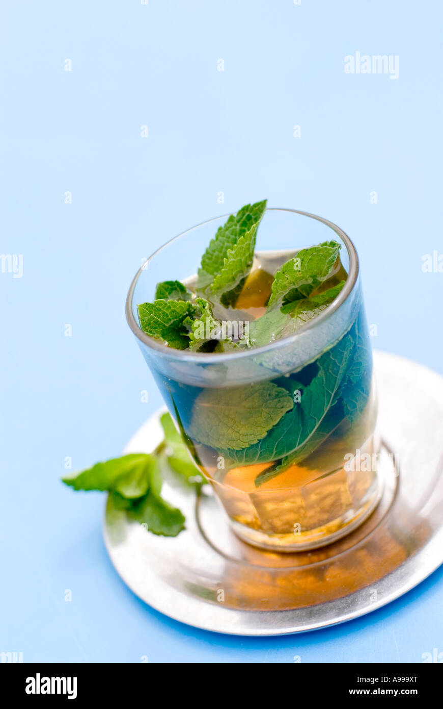 Glass of traditional Moroccan sugary fresh mint tea Marrakesh Morocco ...