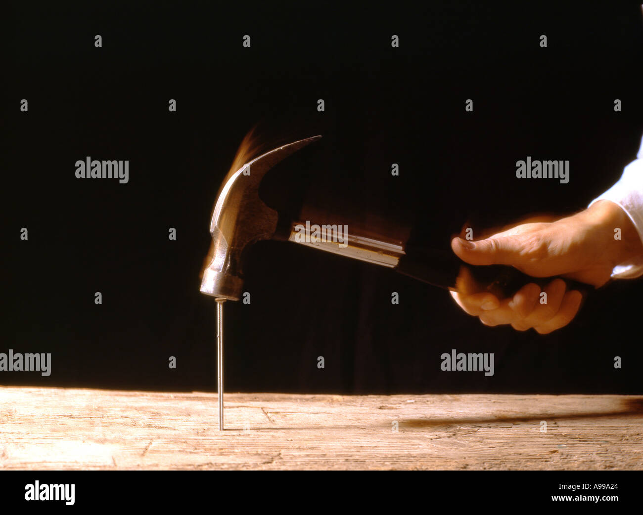 hammer hit the nail Stock Photo - Alamy