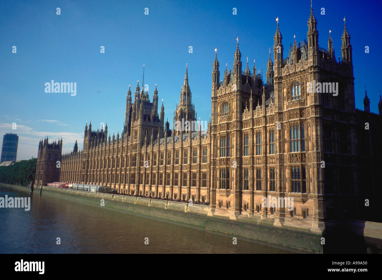 Side view of the Parliament building from Westminster Bridge in London ...