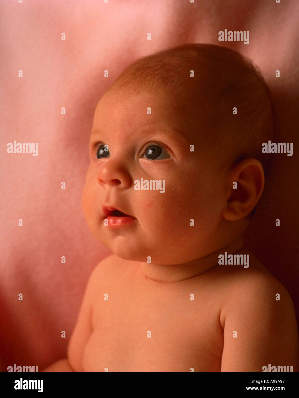 Wide eyed baby Stock Photo - Alamy