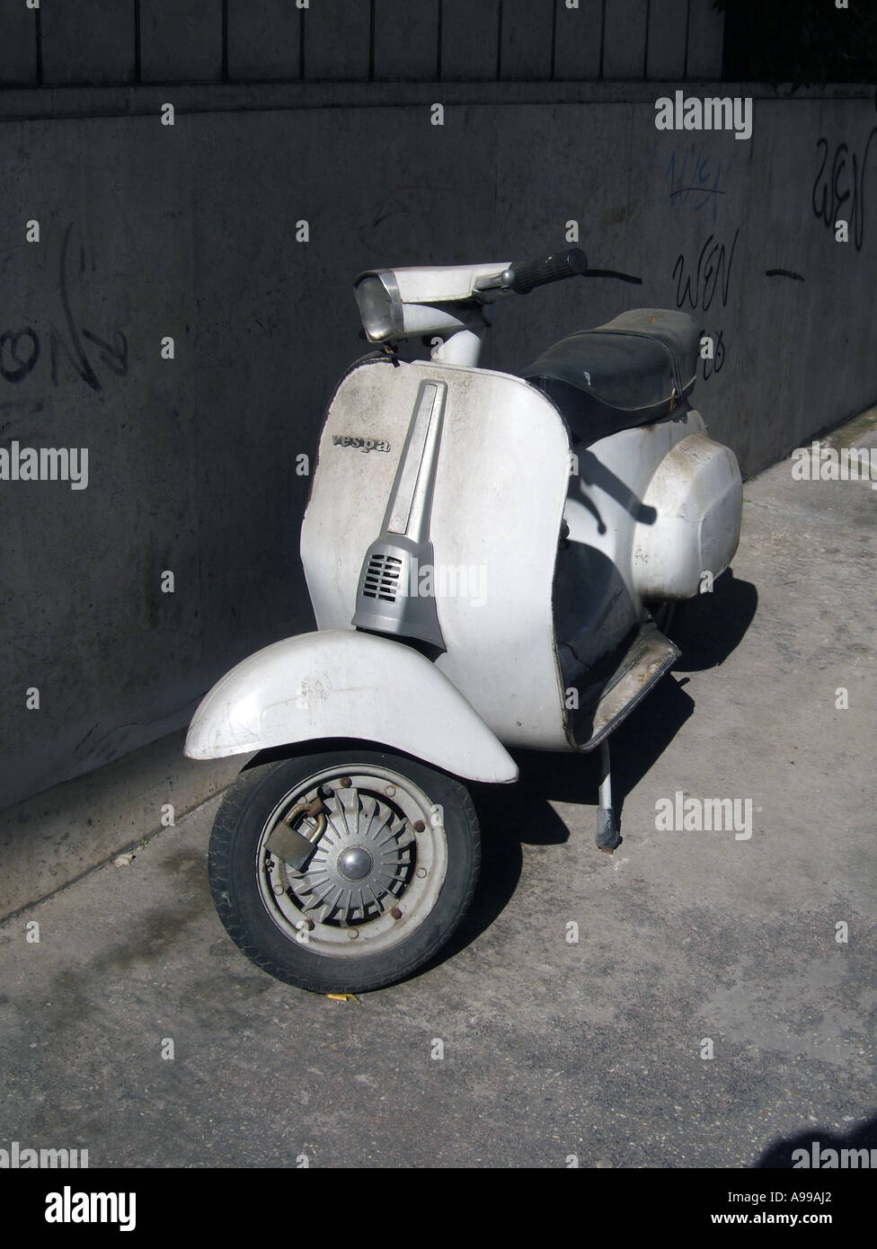 vespa with wheel lock Stock Photo - Alamy