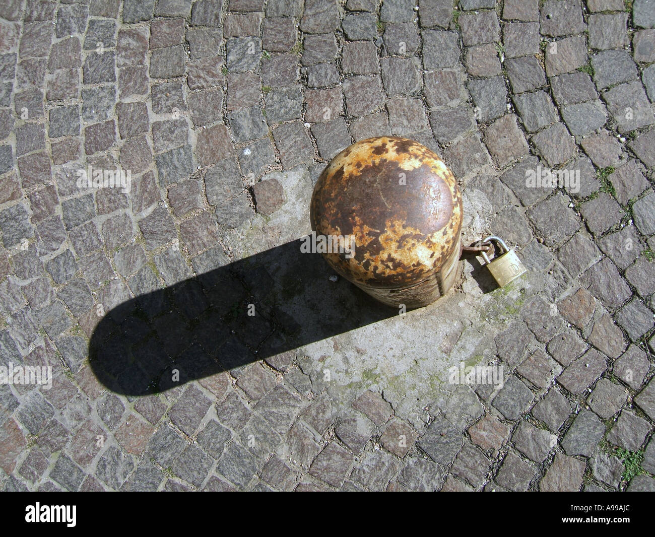 old rusty removable bollard Stock Photo - Alamy