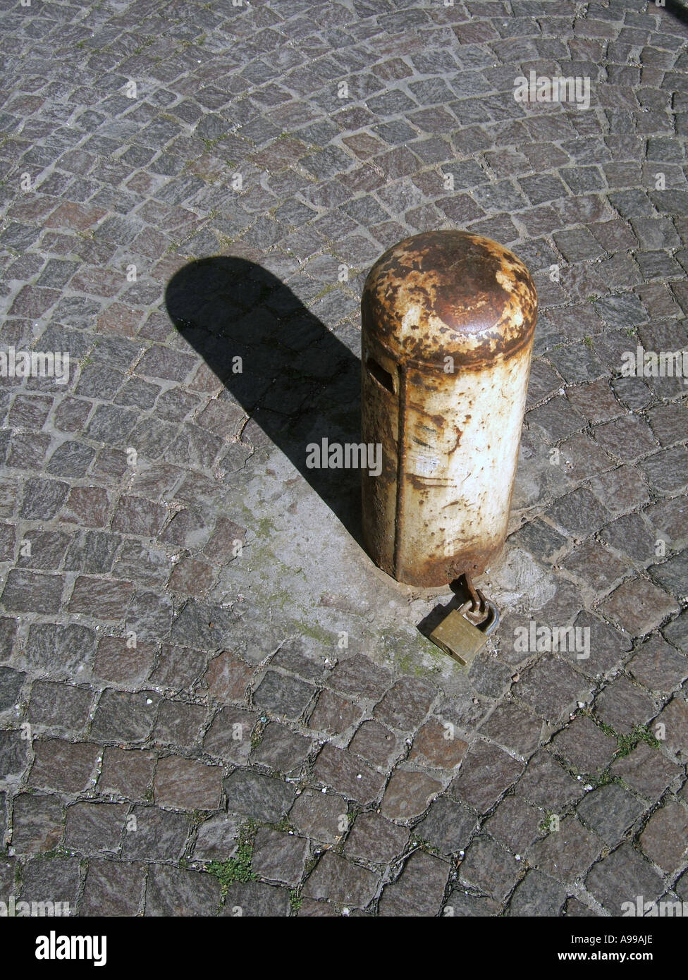 old rusty removable bollard Stock Photo - Alamy