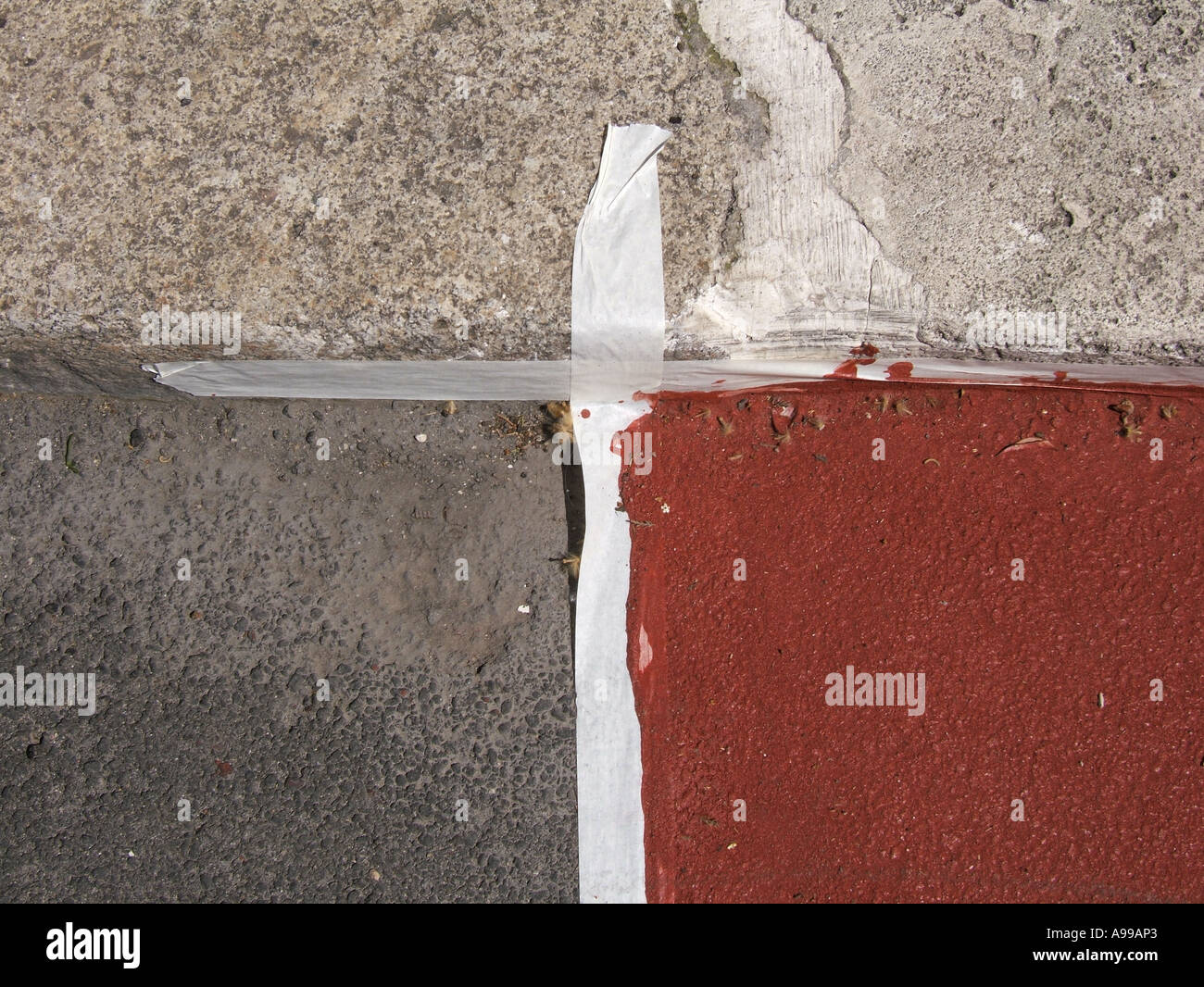 brown red paint on road - cycle path construction Stock Photo - Alamy