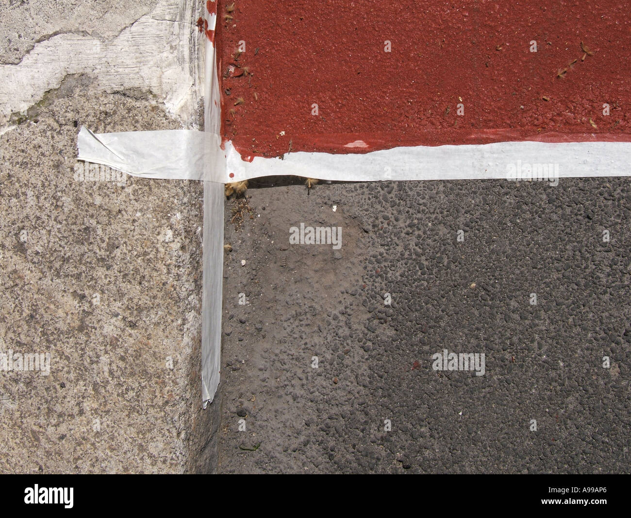 brown red paint on road - cycle path construction Stock Photo - Alamy