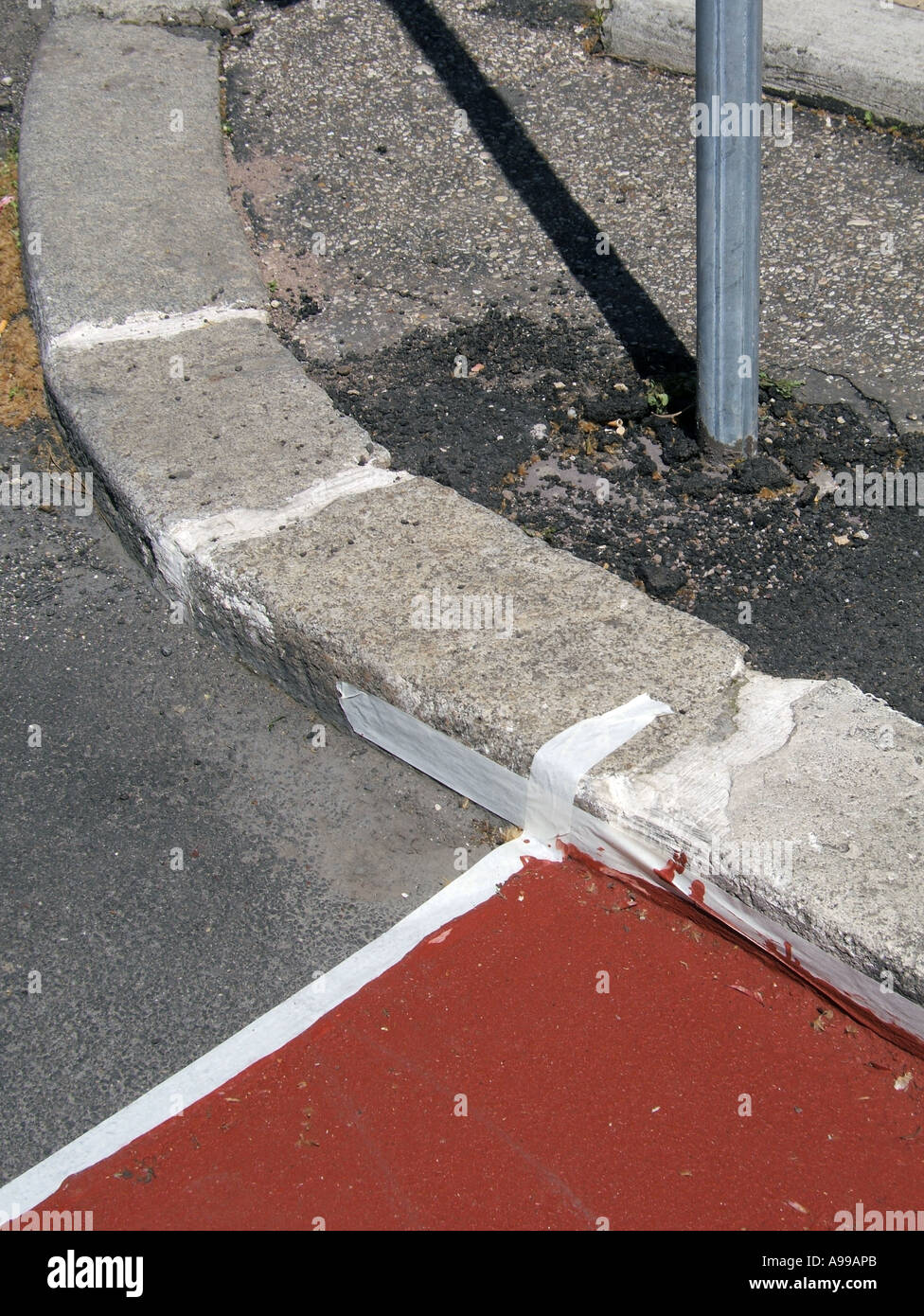 brown red paint on road - cycle path construction Stock Photo - Alamy