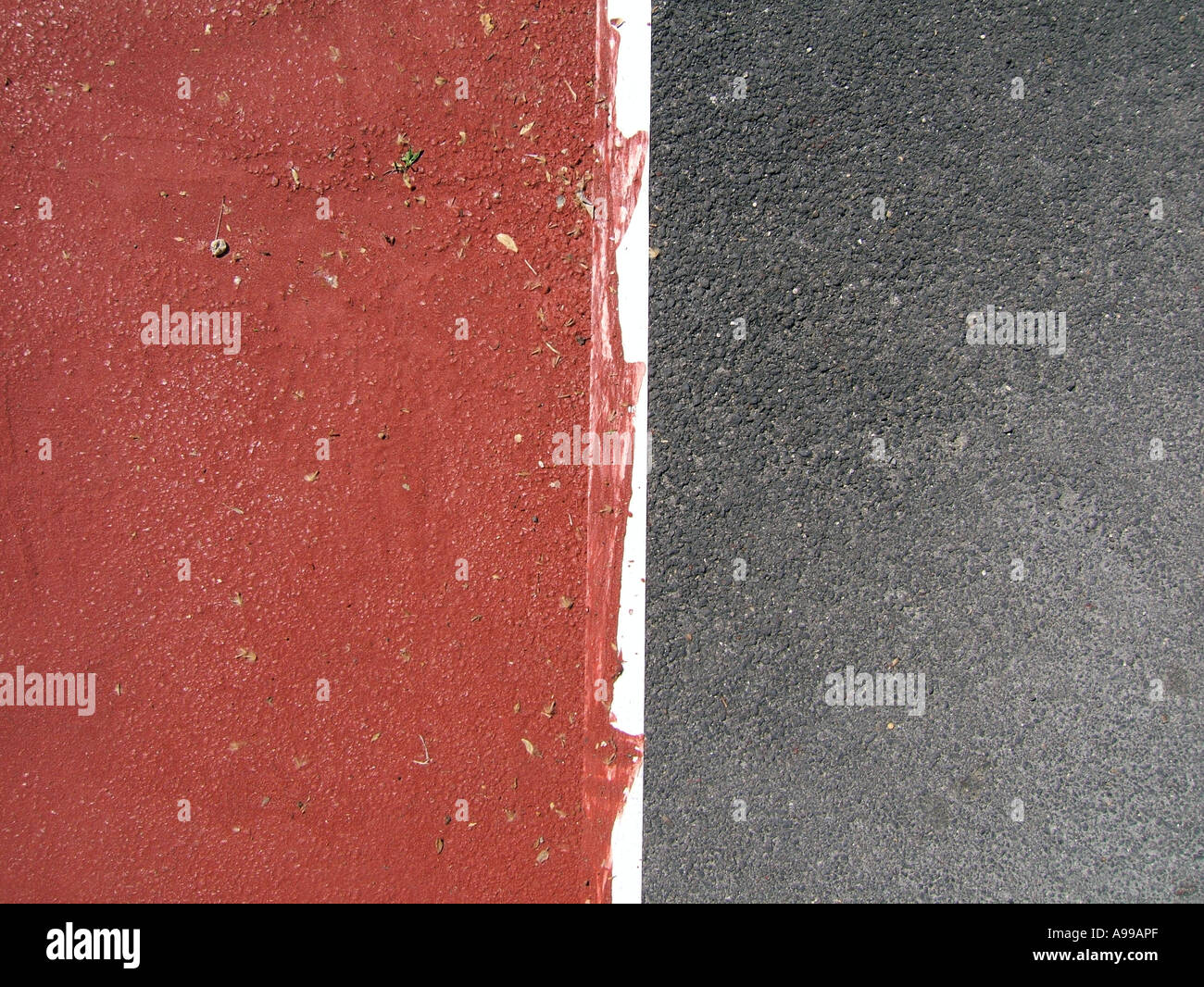 brown red paint on road - cycle path construction Stock Photo - Alamy