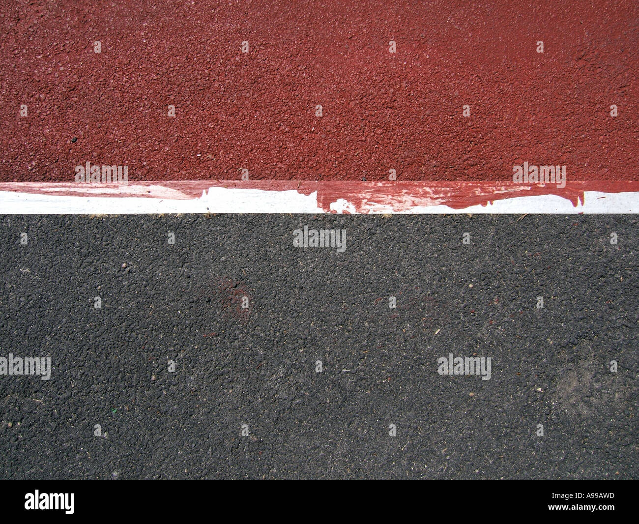 brown red paint on road - cycle path construction Stock Photo - Alamy
