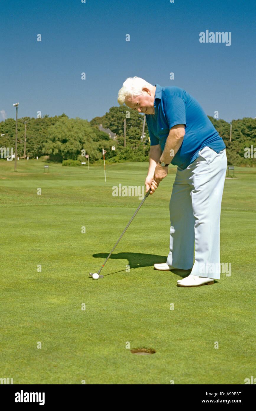 MATURE MAN (70'S) PLAYING GOLF, PUTTING Stock Photo - Alamy