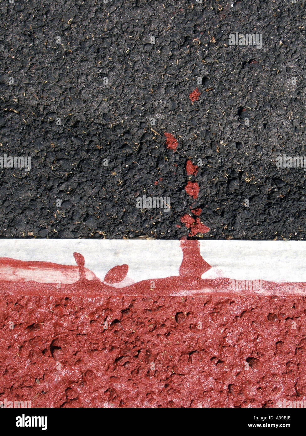 brown red paint on road - cycle path construction Stock Photo - Alamy