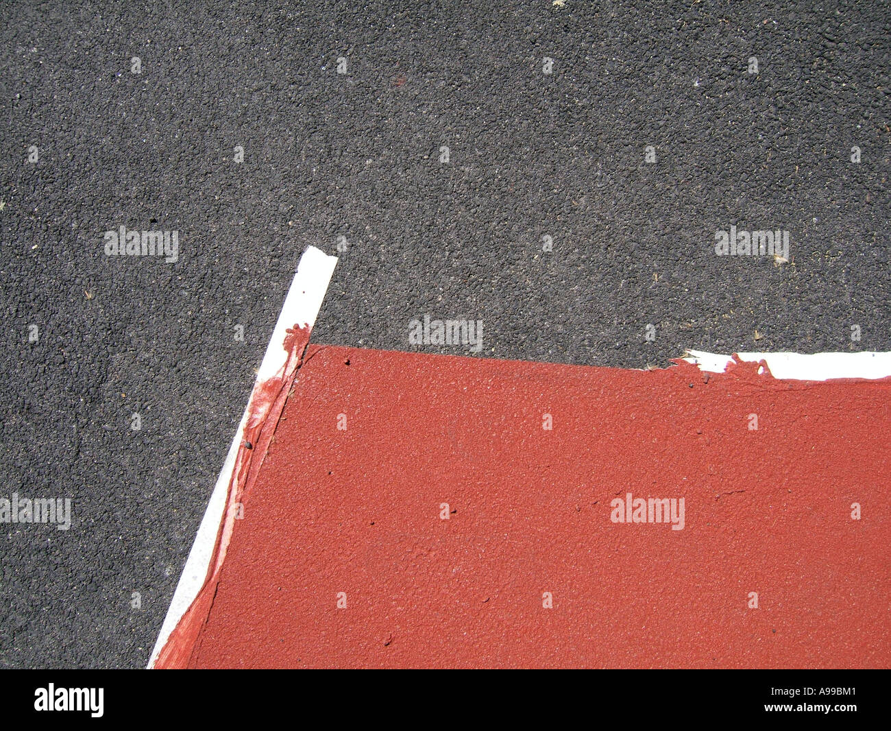 brown red paint on road - cycle path construction Stock Photo - Alamy