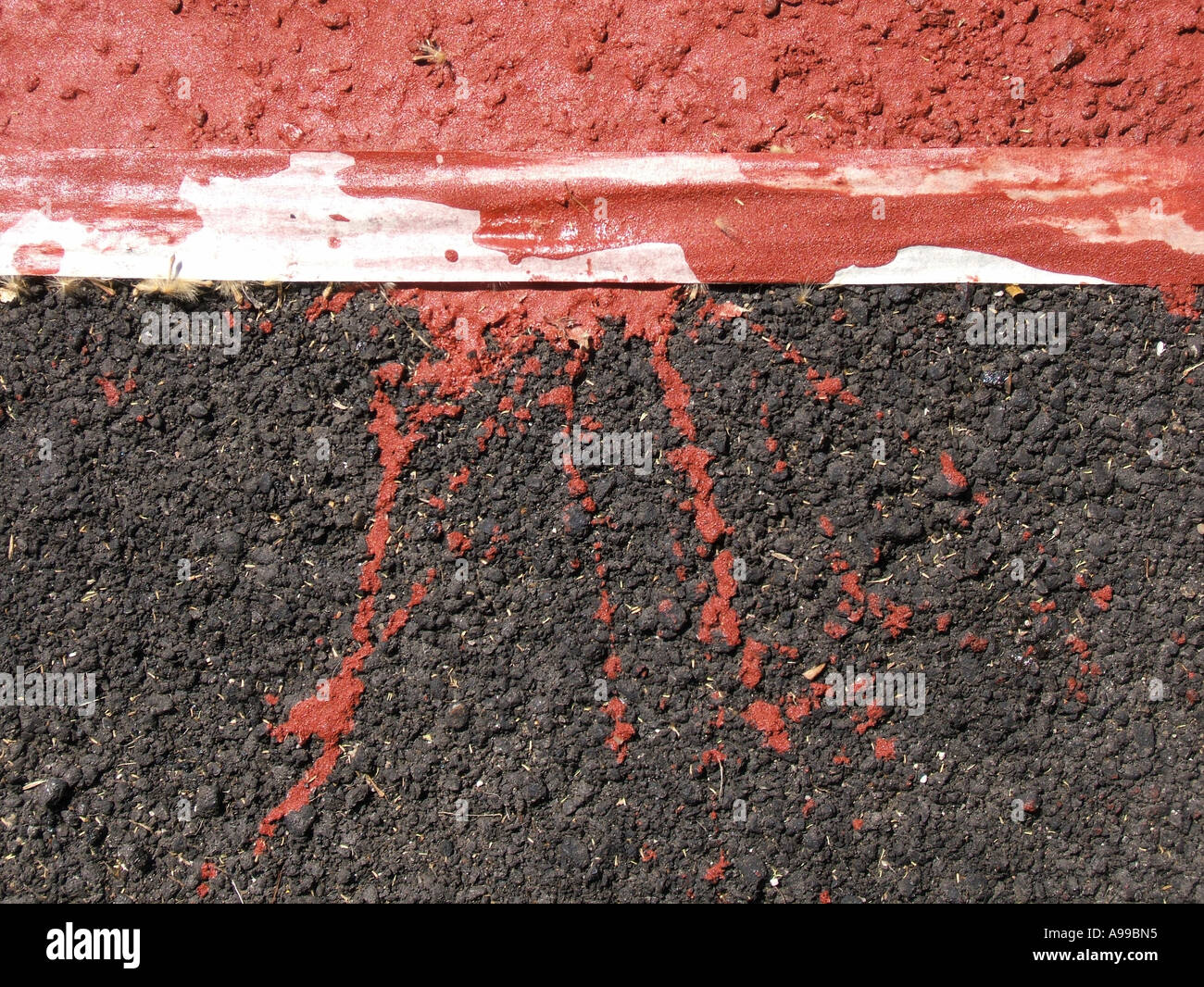 brown red paint on road - cycle path construction Stock Photo - Alamy