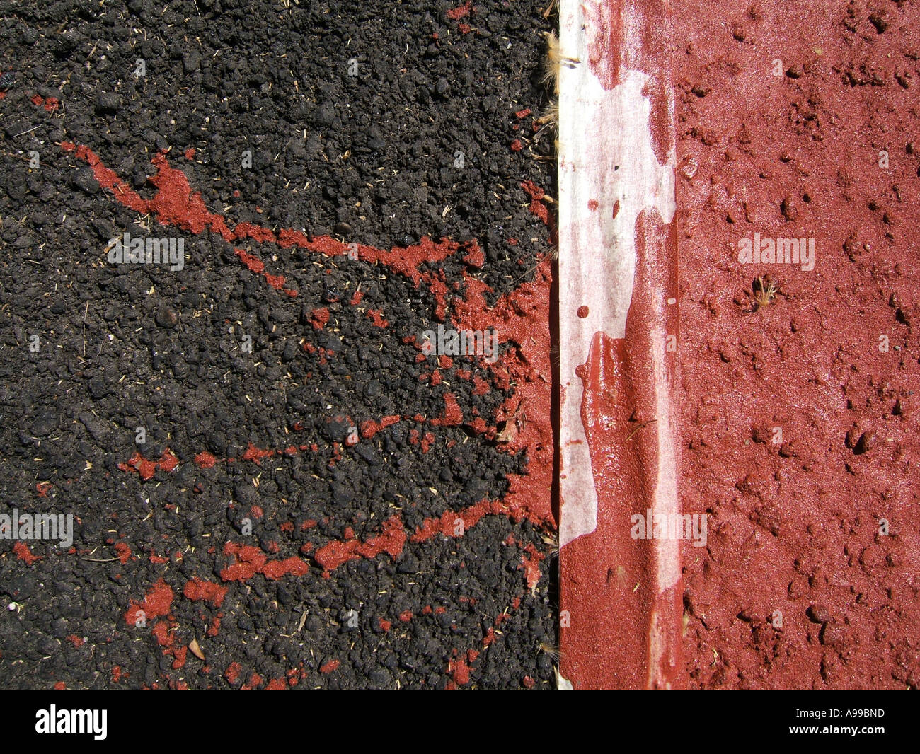 brown red paint on road - cycle path construction Stock Photo - Alamy