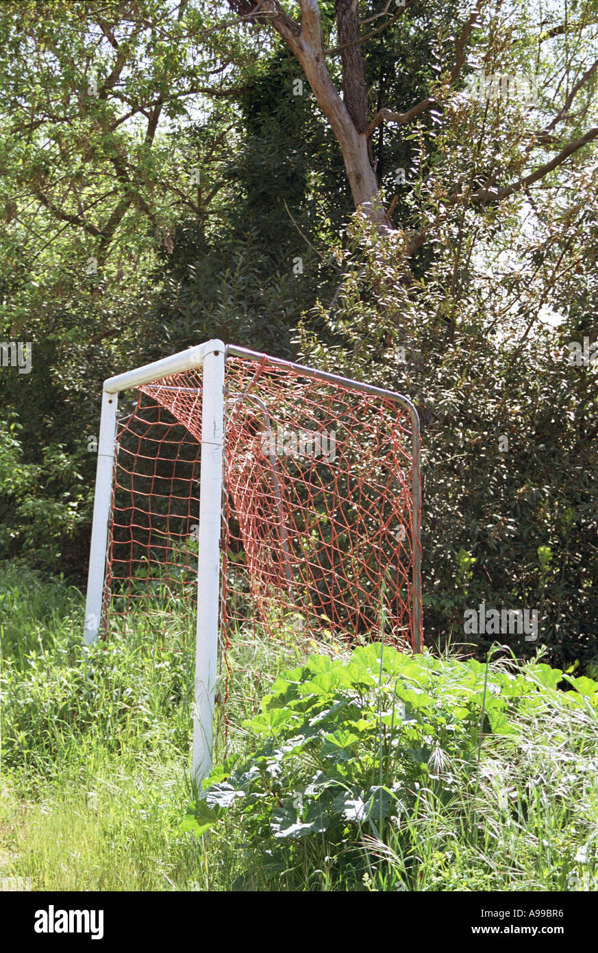 goal posts and overgrown grass Stock Photo - Alamy