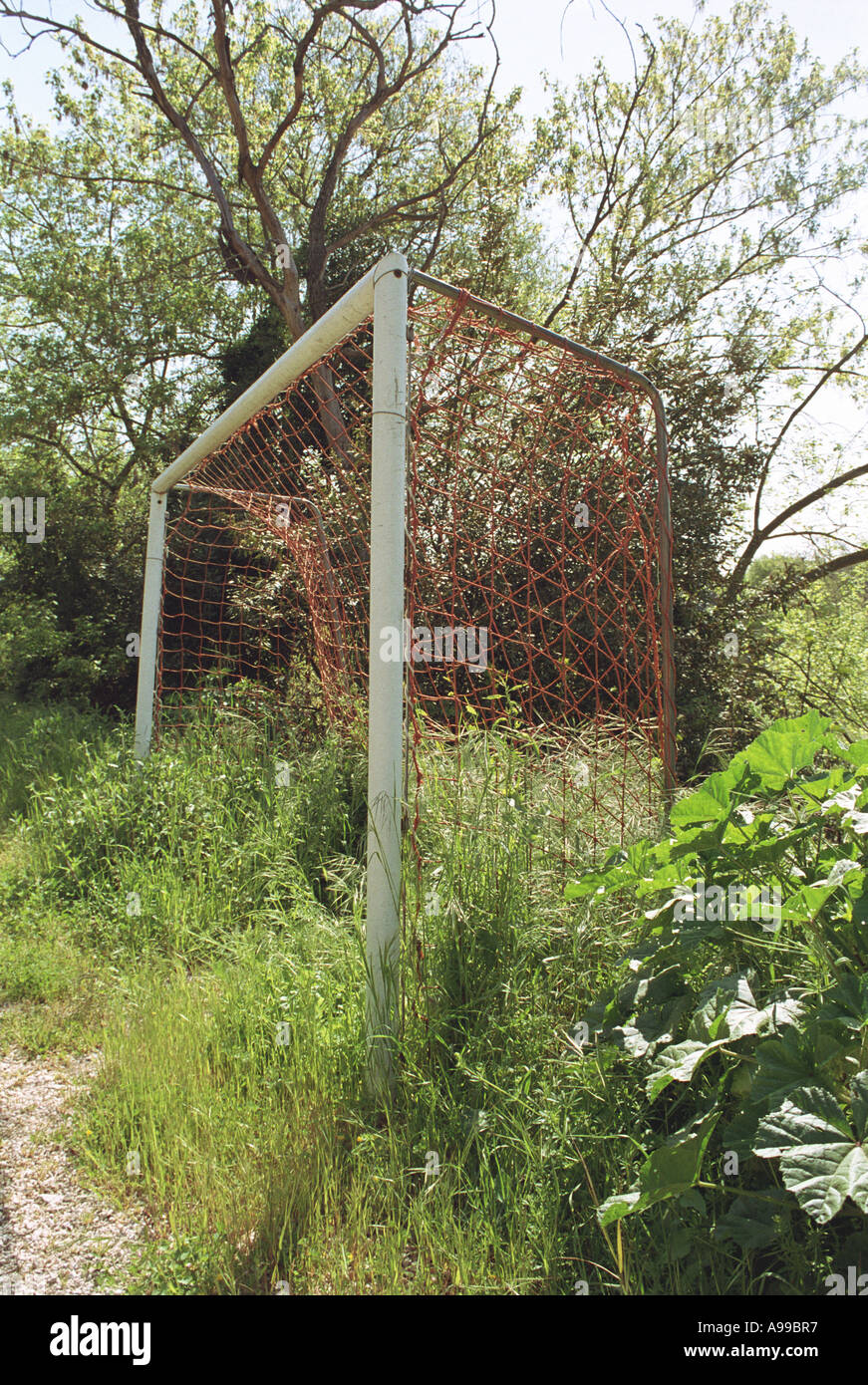 goal posts and overgrown grass Stock Photo - Alamy