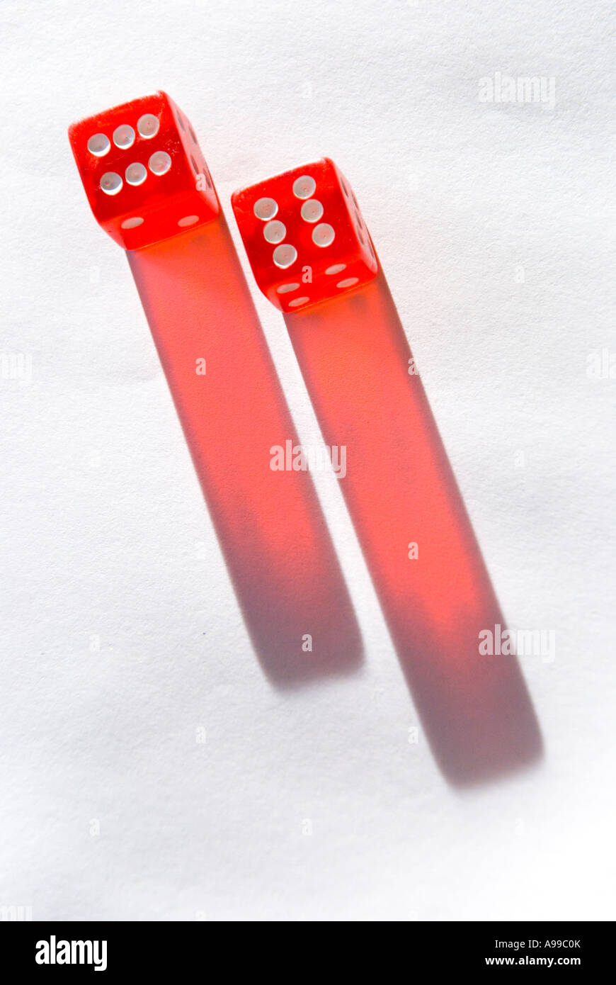 A red pair of dice on a white background Stock Photo - Alamy