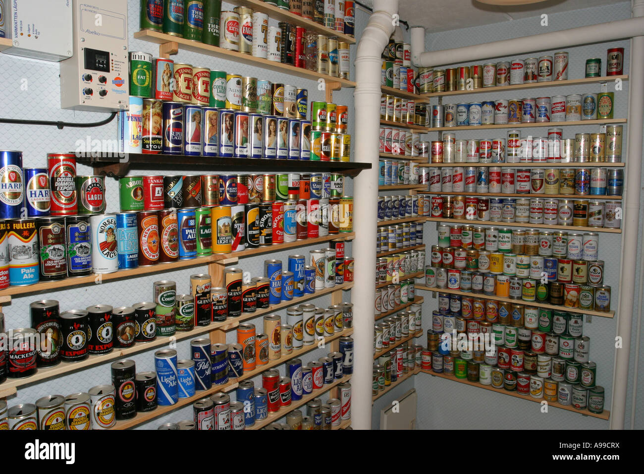 Many Old Beer Can on bookcase Stock Photo - Alamy