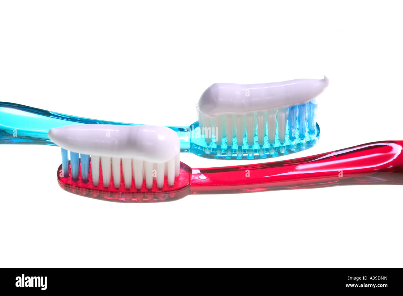 Two toothbrushes with paste on isolated on white Stock Photo - Alamy