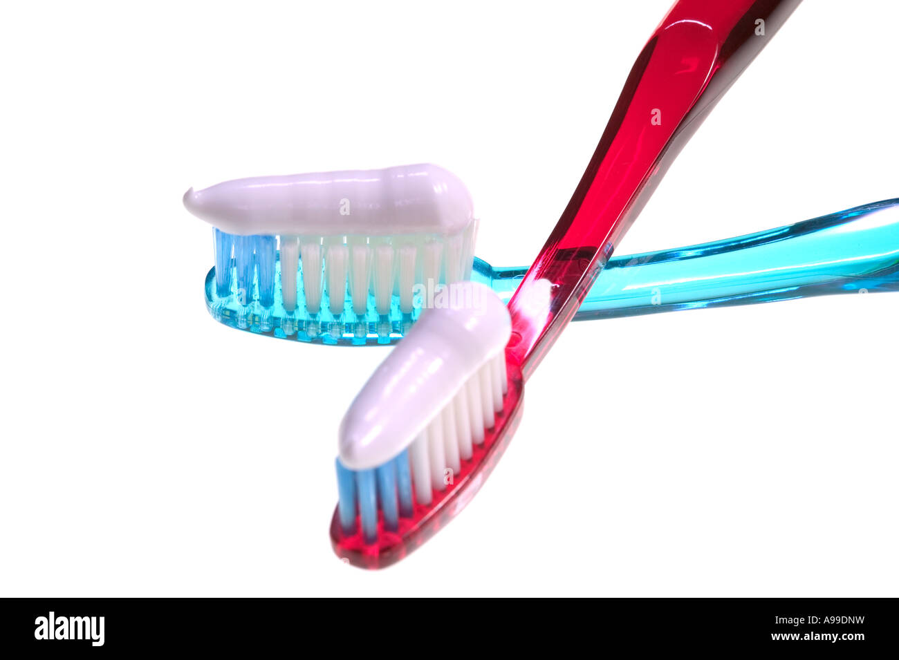 Two toothbrushes focus on the blue one isolated on white Stock Photo ...