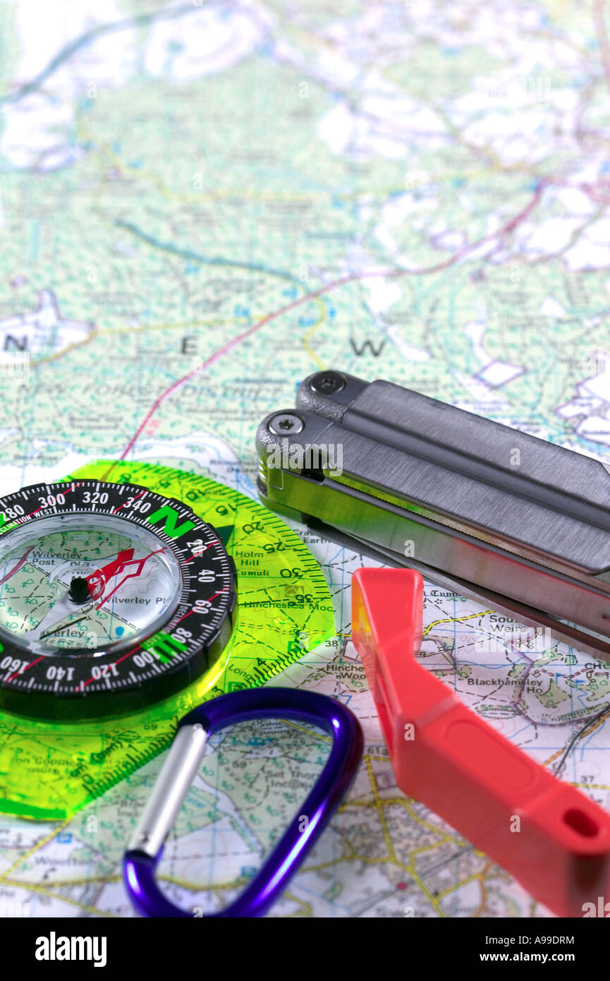 Outdoor adventure image with a map as background Stock Photo - Alamy