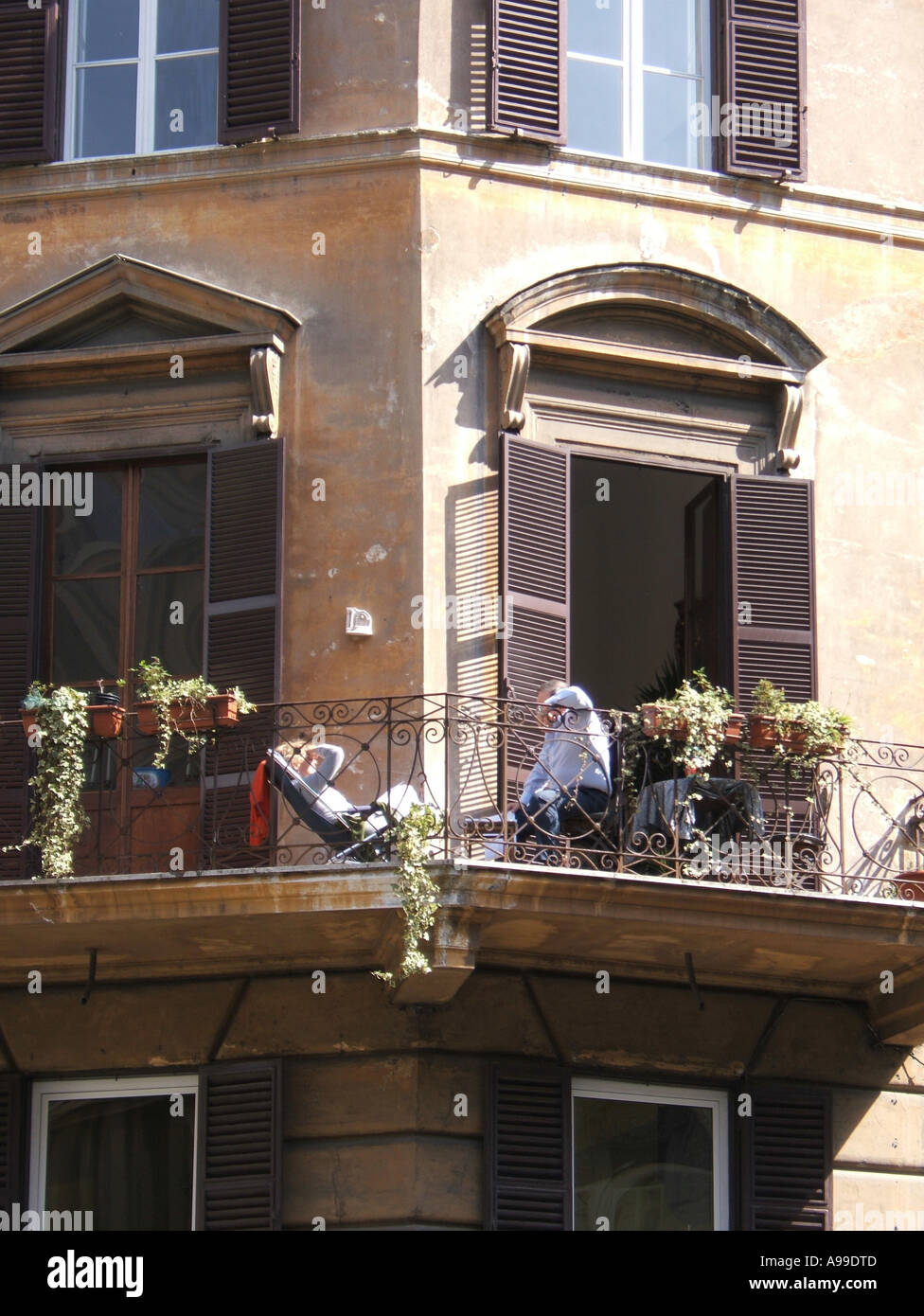 people sitting on terrace in rome Stock Photo - Alamy