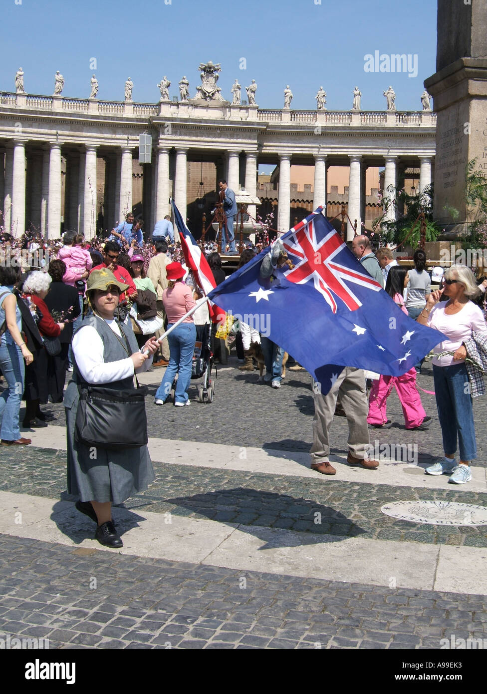 australian nun waving flag in st peter's square in rome at easter time ...