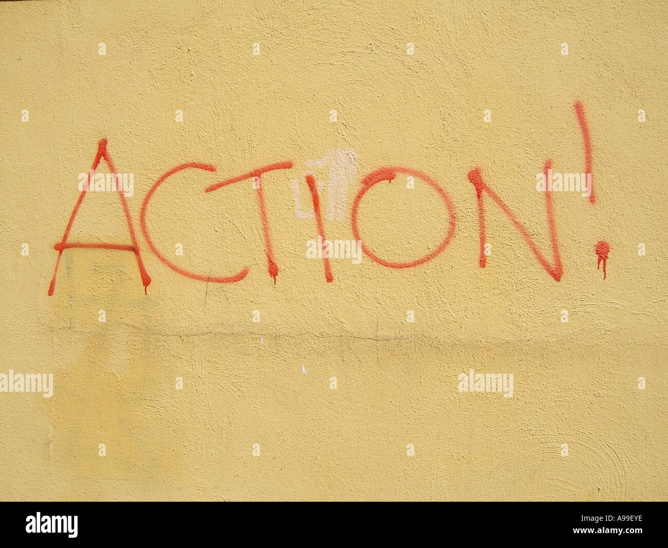 the word action written on yellow wall Stock Photo - Alamy