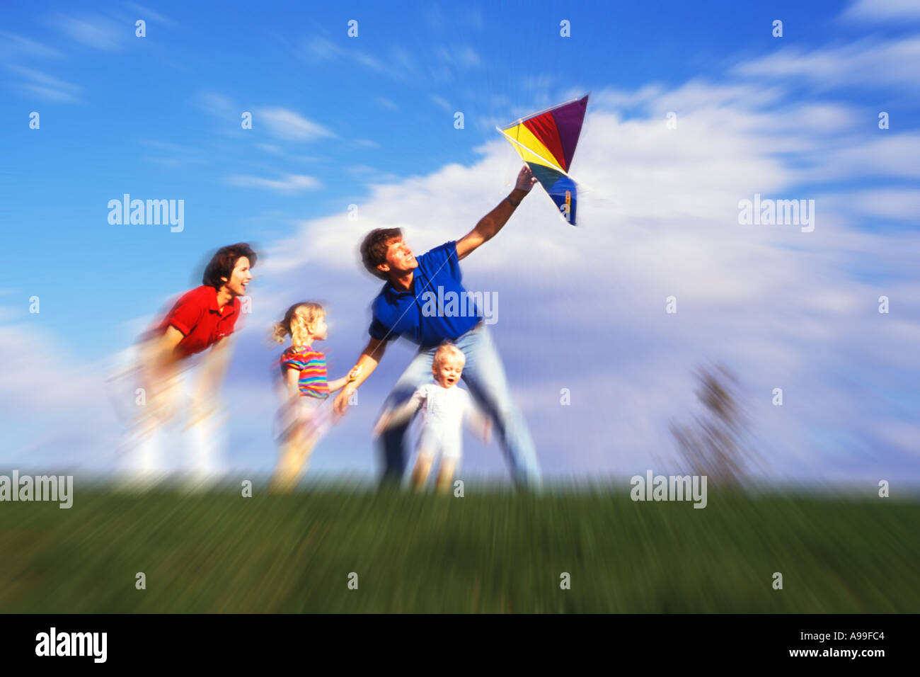 Family flying kite Stock Photo - Alamy