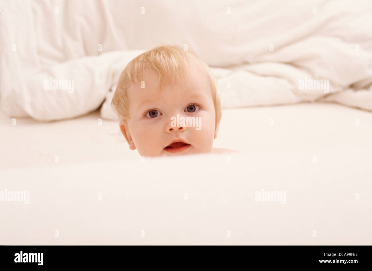 Peeking over bed sheets hi-res stock photography and images - Alamy