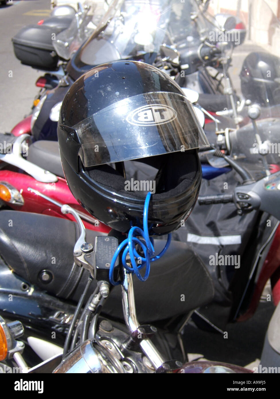 helmet locked to motorbike Stock Photo - Alamy