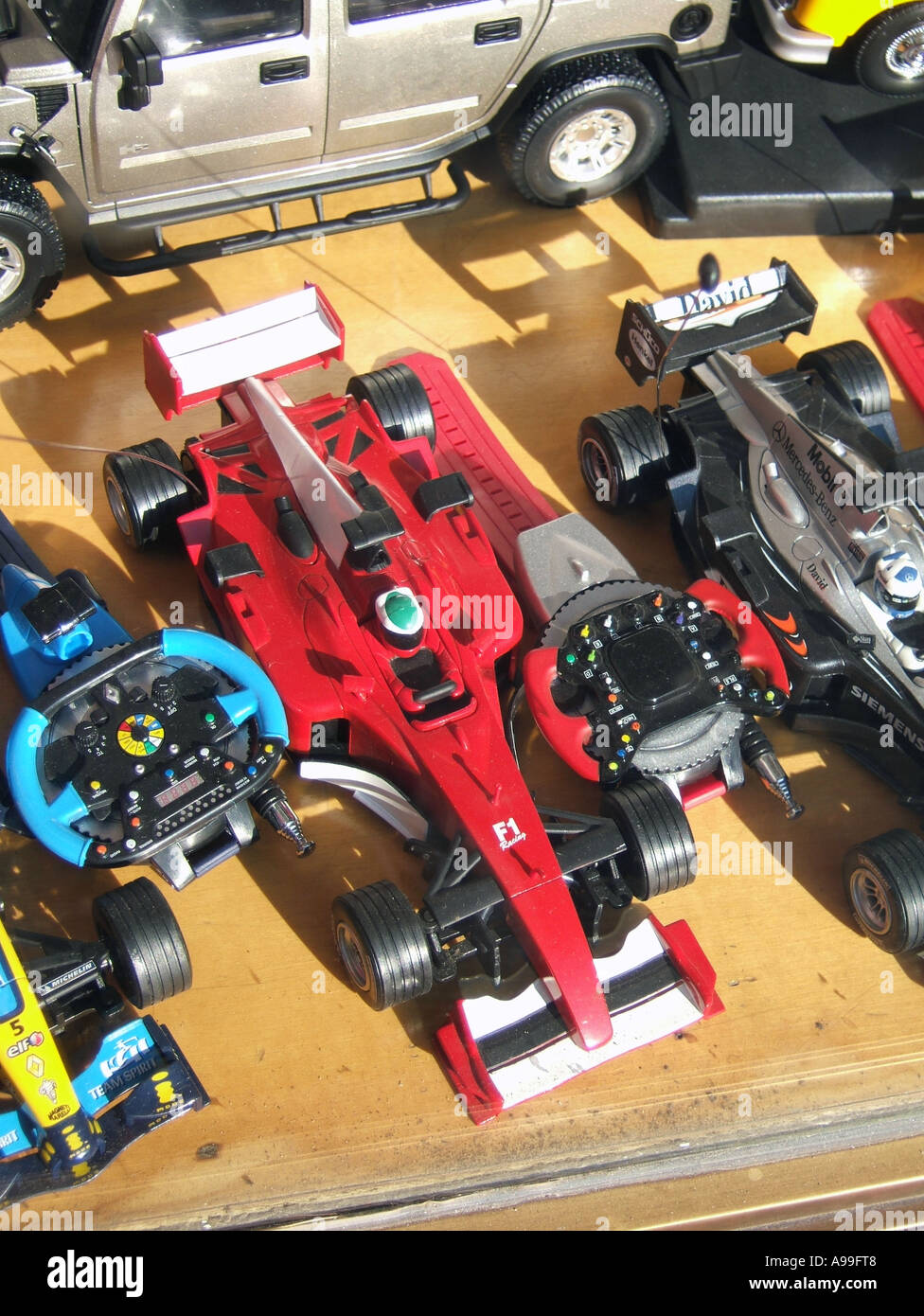 three formula one miniature toy cars in shop window Stock Photo - Alamy
