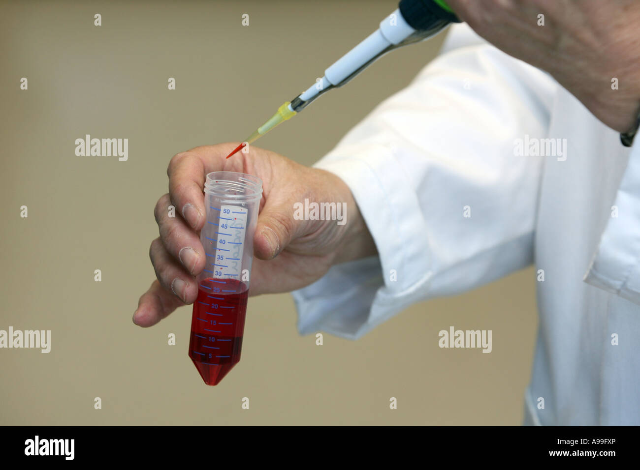 Hands using pipette in science lab Stock Photo - Alamy