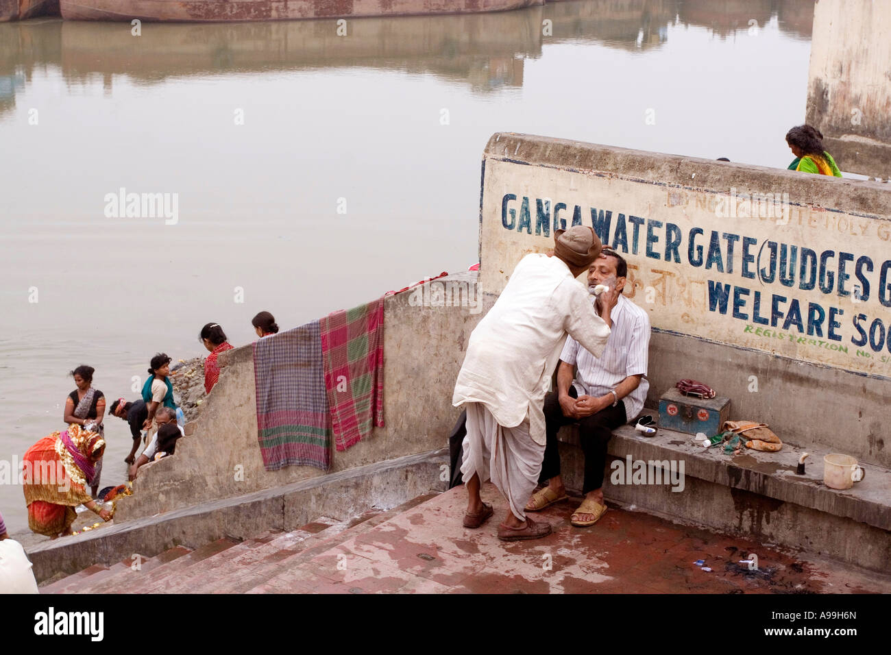 Man Shaving another on the Banks of Hooghly River Calcutta North India ...