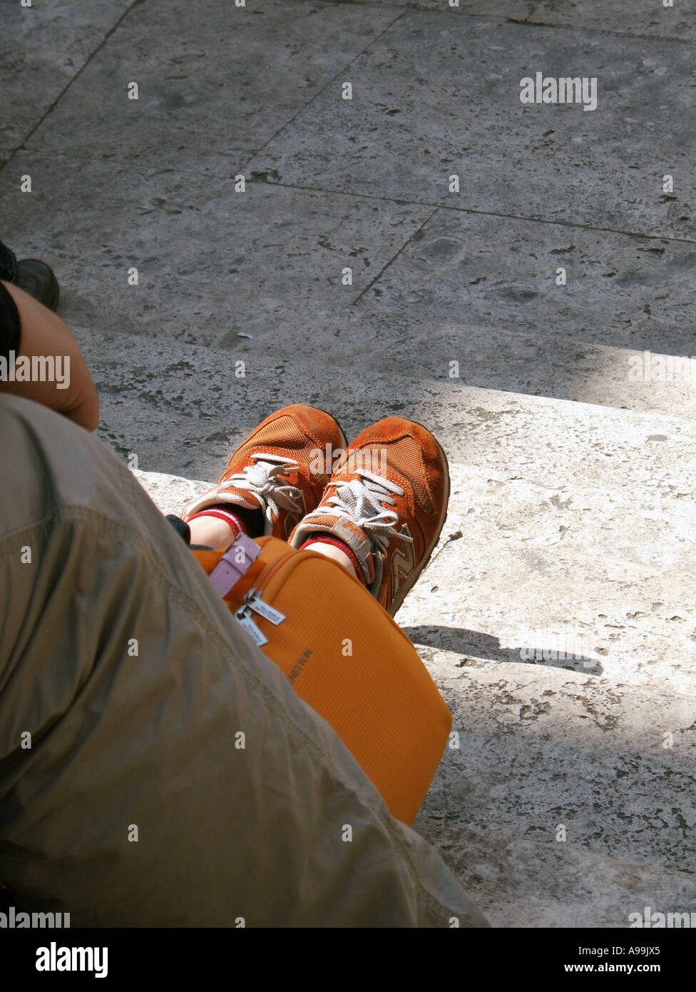 woman sitting on steps Stock Photo - Alamy