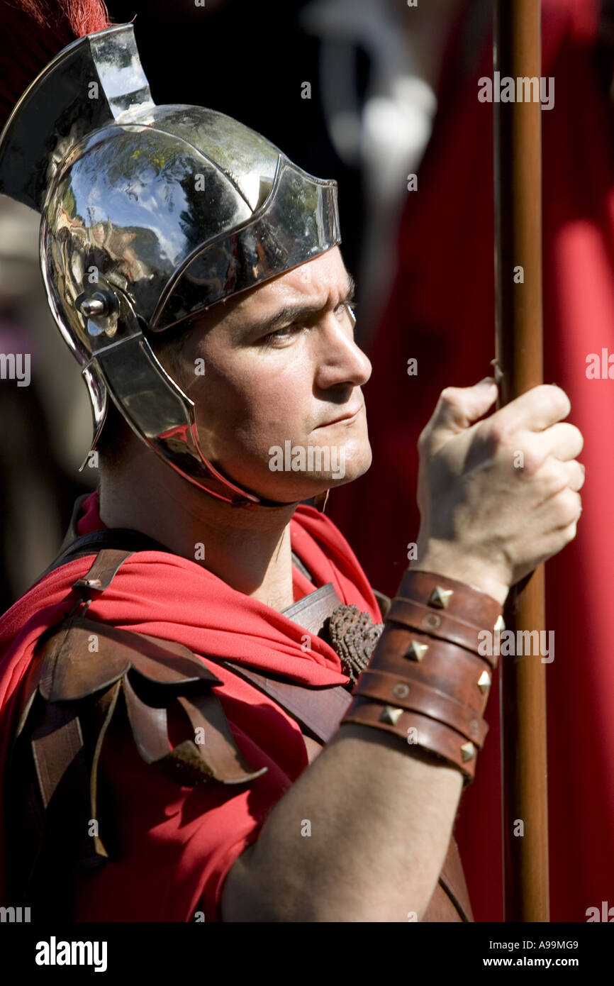 Actor portraying Roman soldier wearing helmet and holding lance, Holy ...