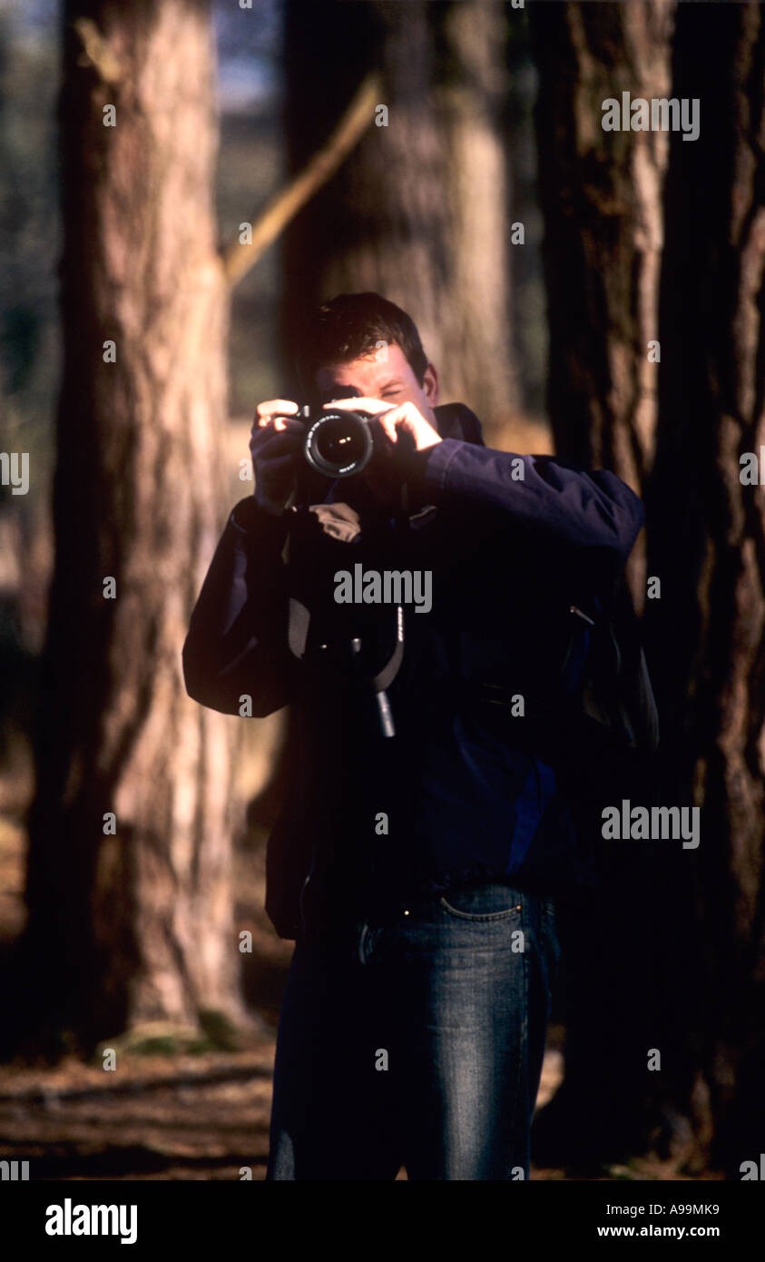 Man taking photograph Stock Photo - Alamy